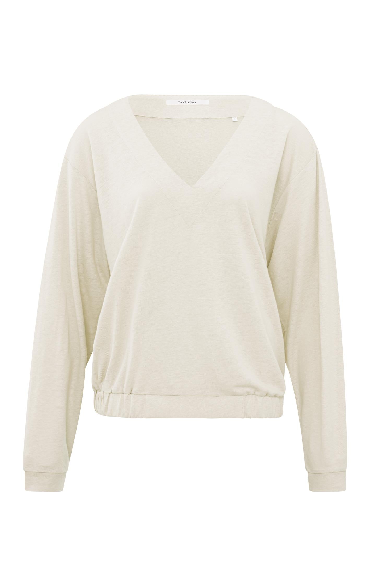 Beige top with long sleeves, V-neck and elastic hem