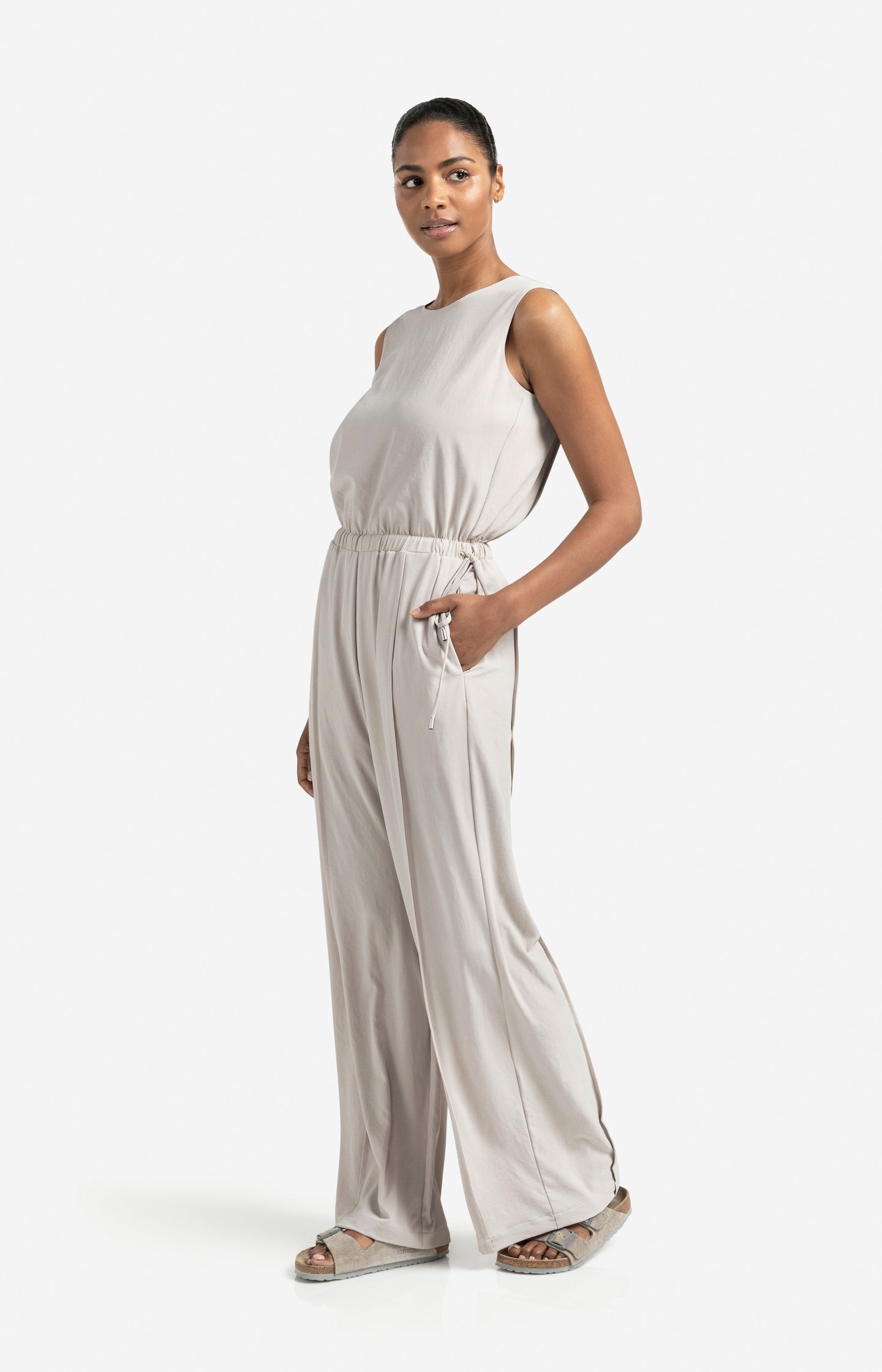 Sleeveless woven jumpsuit with cord detail