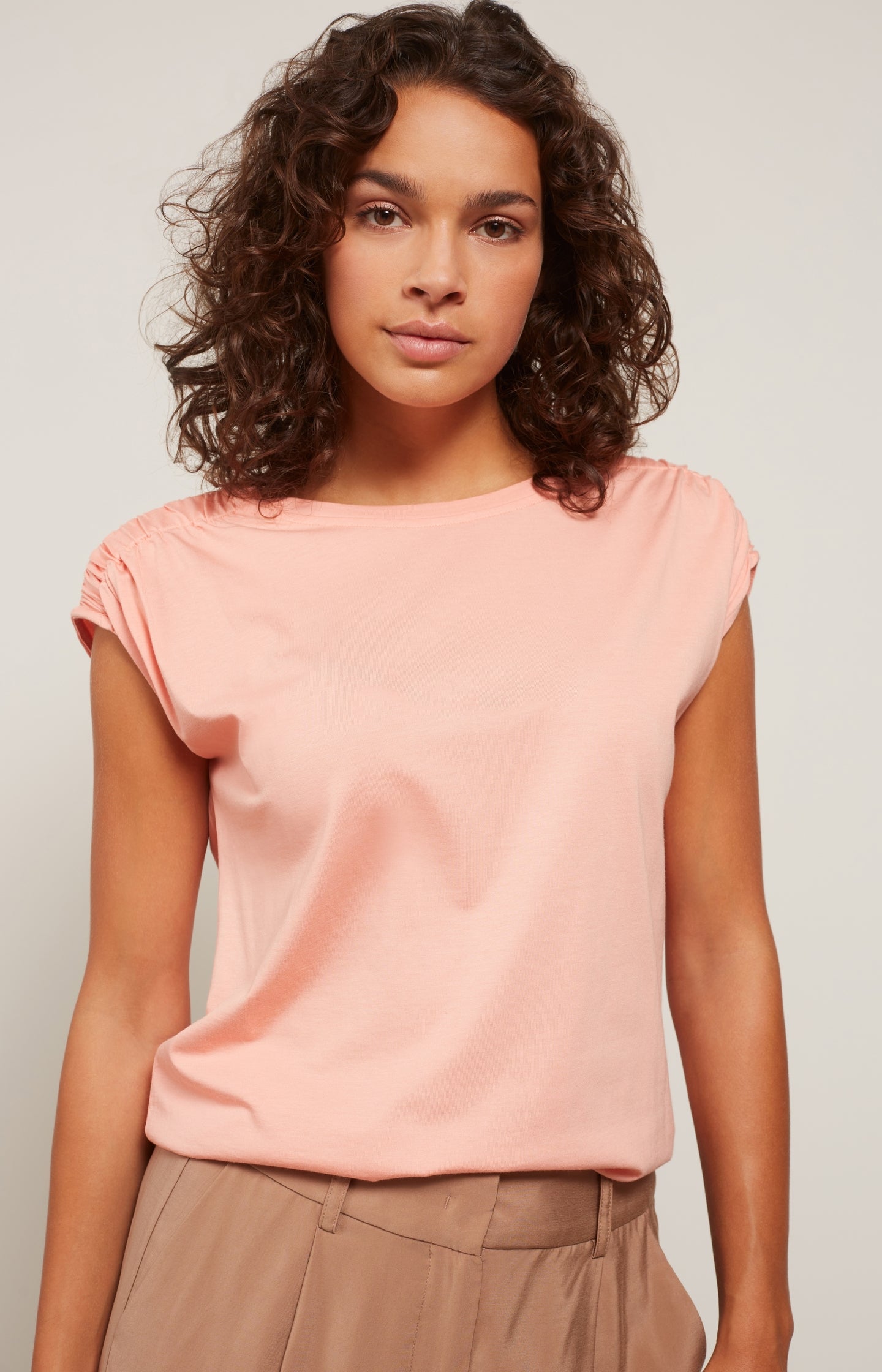 Top with boatneck, cap sleeves and shoulder details